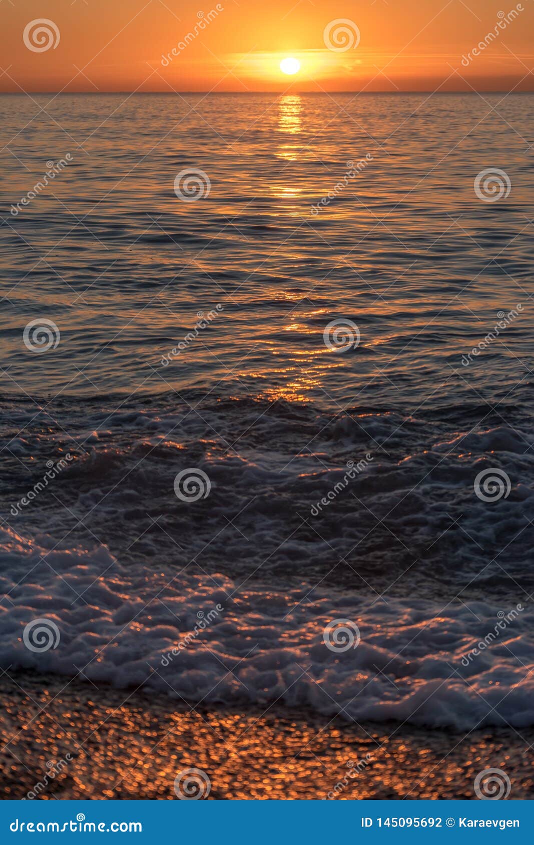 Bright Sunset with a Yellow Sun Above the Sea Surface Stock Photo ...