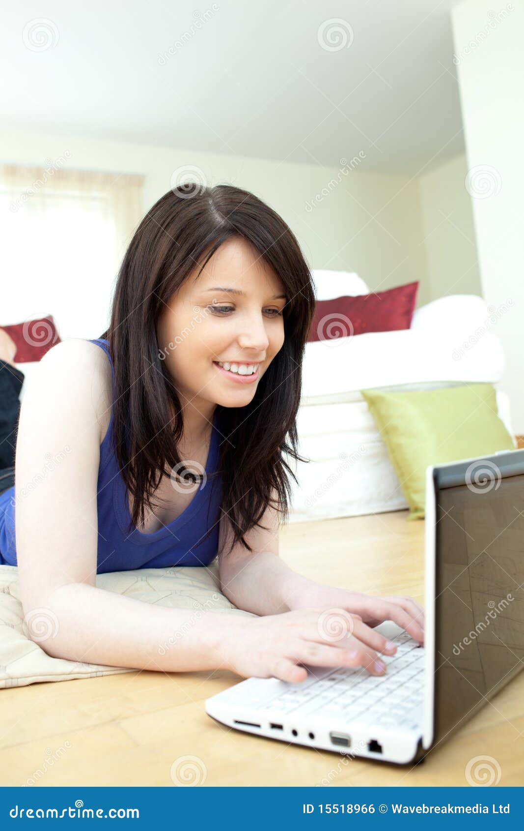 Bright Teenager Using Her Laptop on the Floor Stock Photo - Image of ...