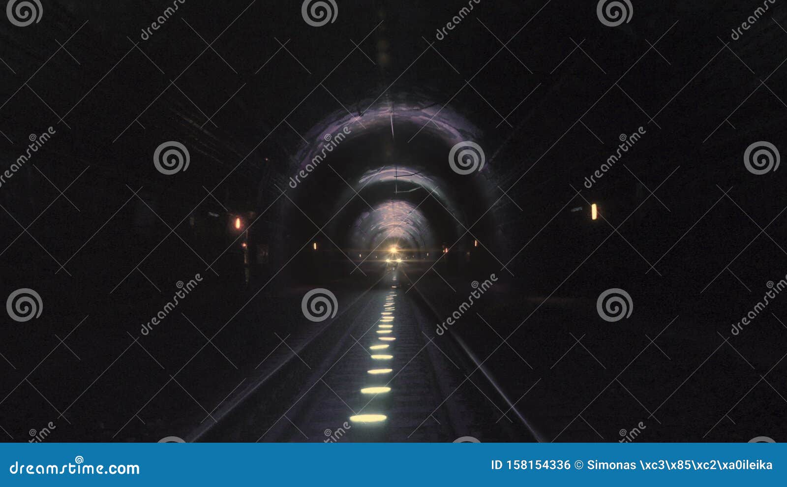 Bright Train Lights Coming Towards Camera in a Dark Railway Tunnel ...