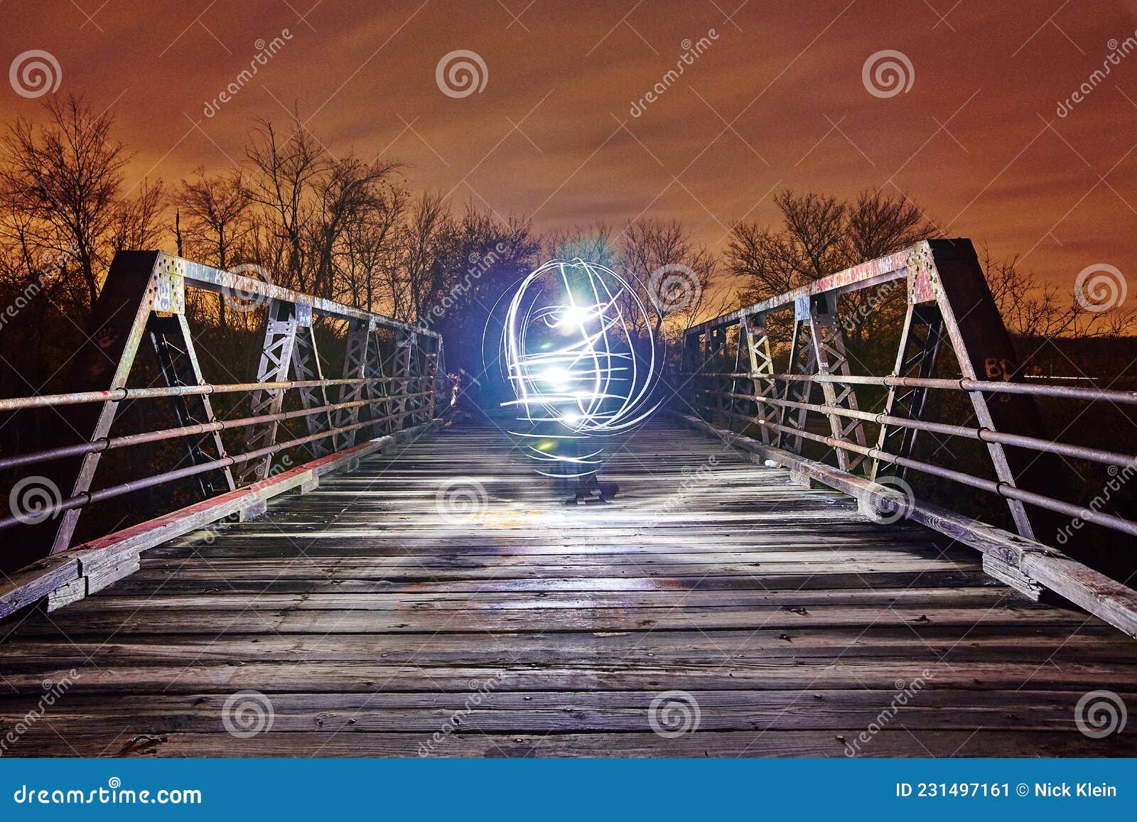 Bright White Sphere of Light Illuminates a White Bridge at Twilight ...