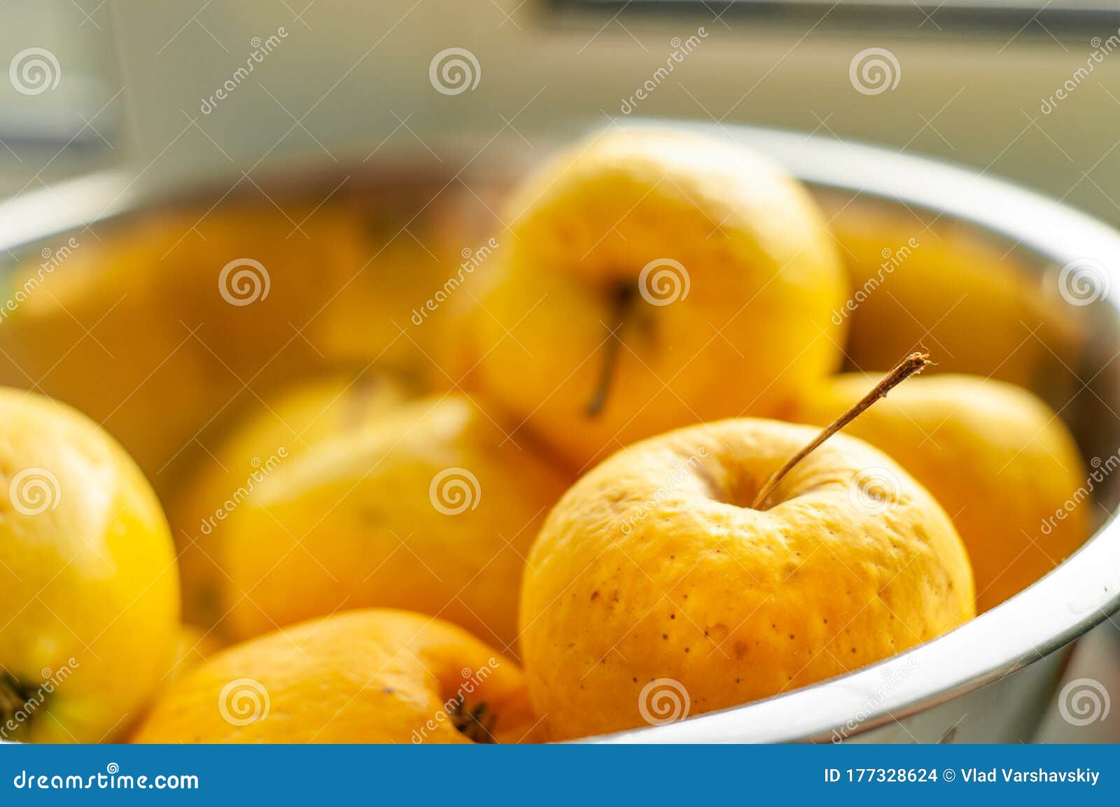 Bright Yellow Apples with Wrinkled Peels Lie in a Container on the ...
