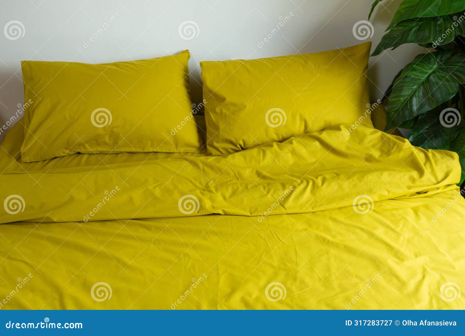 Bright Yellow Crumpled Bed Linen on an Unmade Bed Stock Image - Image ...