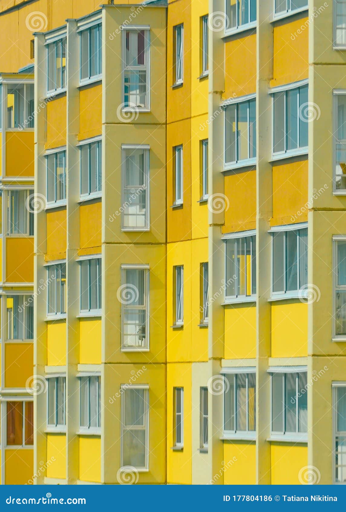 Bright Yellow Facade of a Typical High-rise Building Stock Photo ...