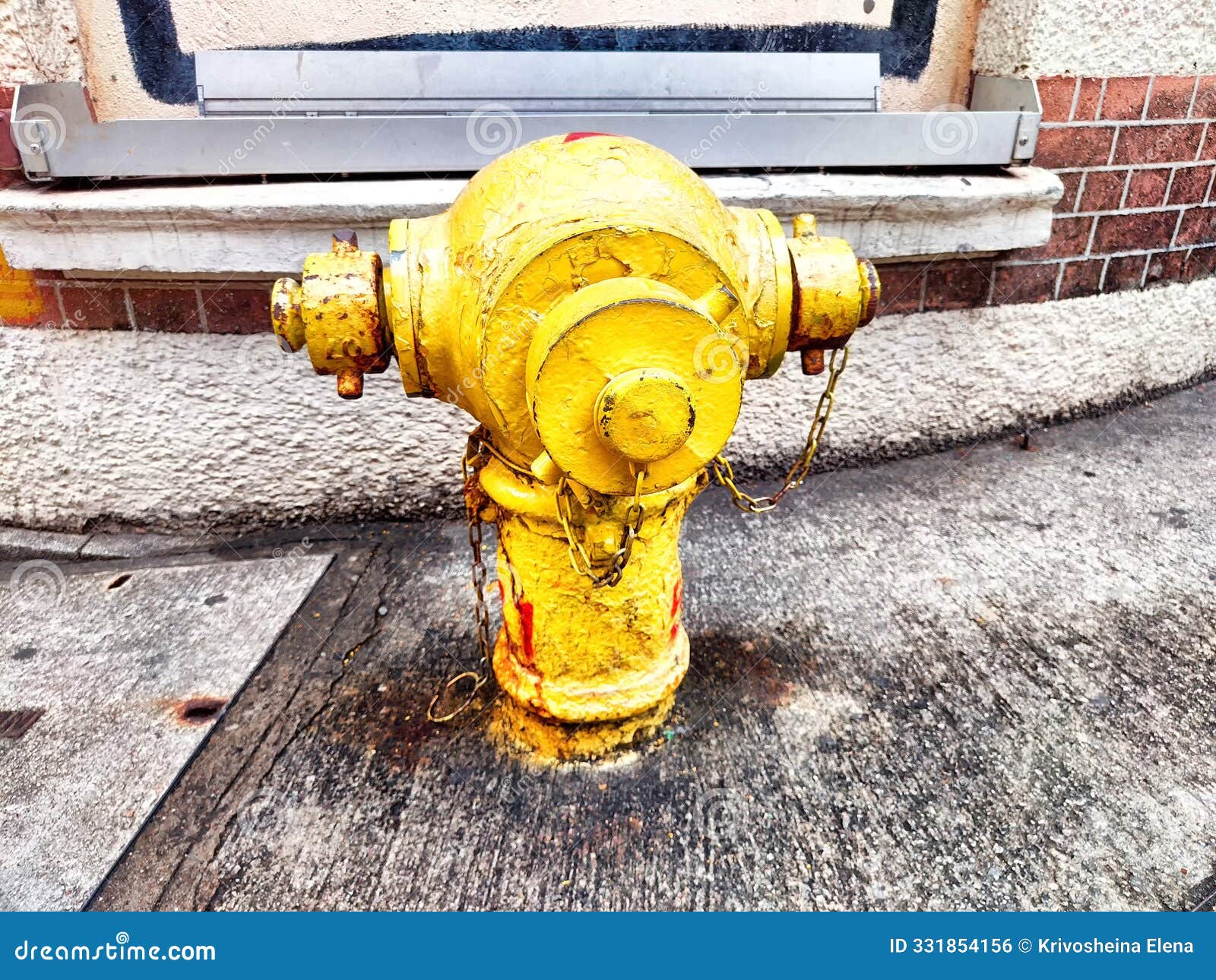 A Bright Yellow Fire Hydrant Stands on a Concrete Sidewalk, with a ...