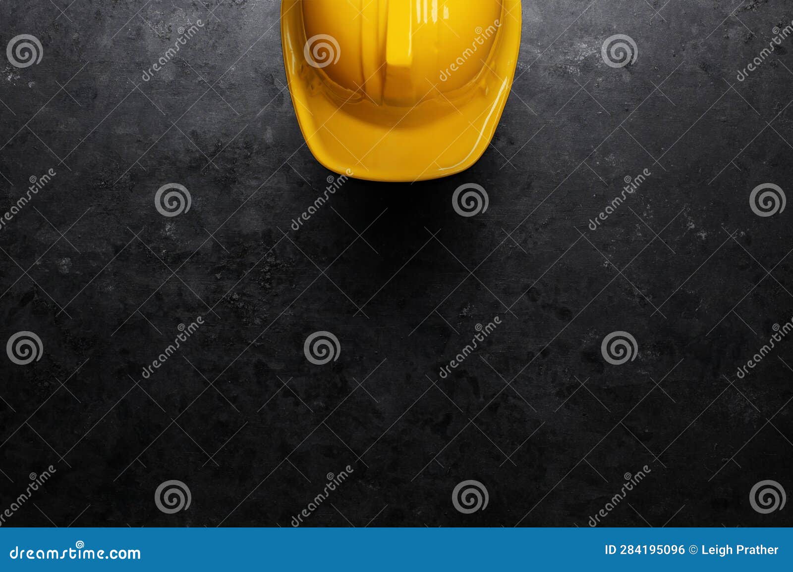 Bright Yellow Hard Hat on Dark Black Background. Contractor or Under ...