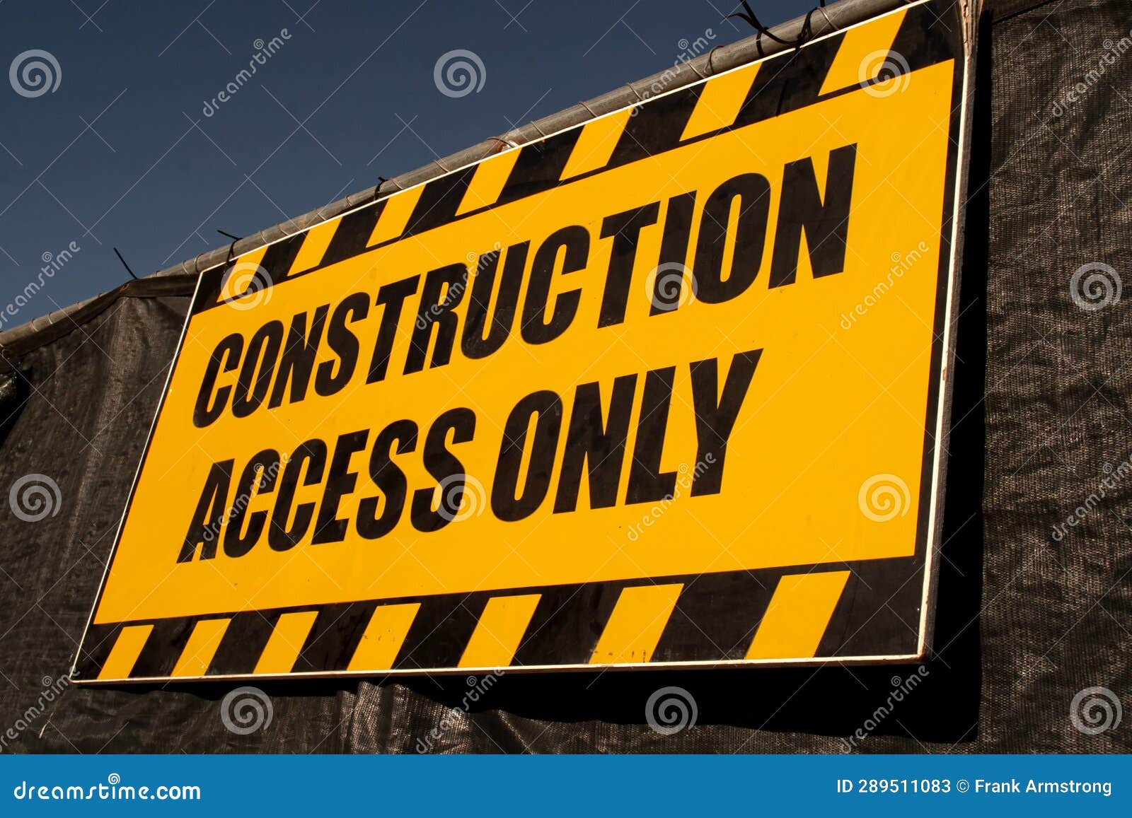 Bright Yellow Sign with Black Capital Letters Stating Construction ...