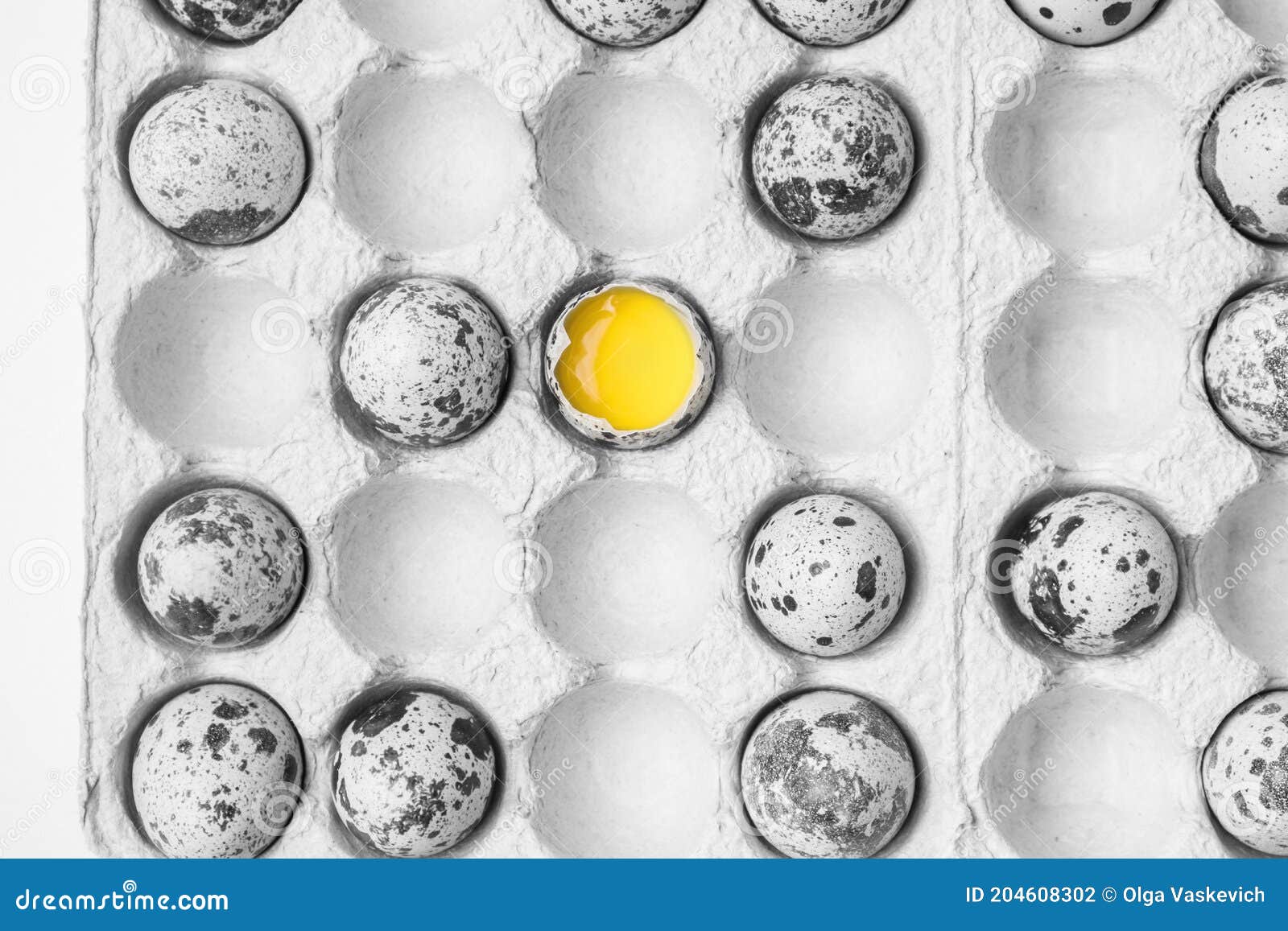 Bright Yellow Yolk in a Broken Egg Against a Discolored Gray Image of ...