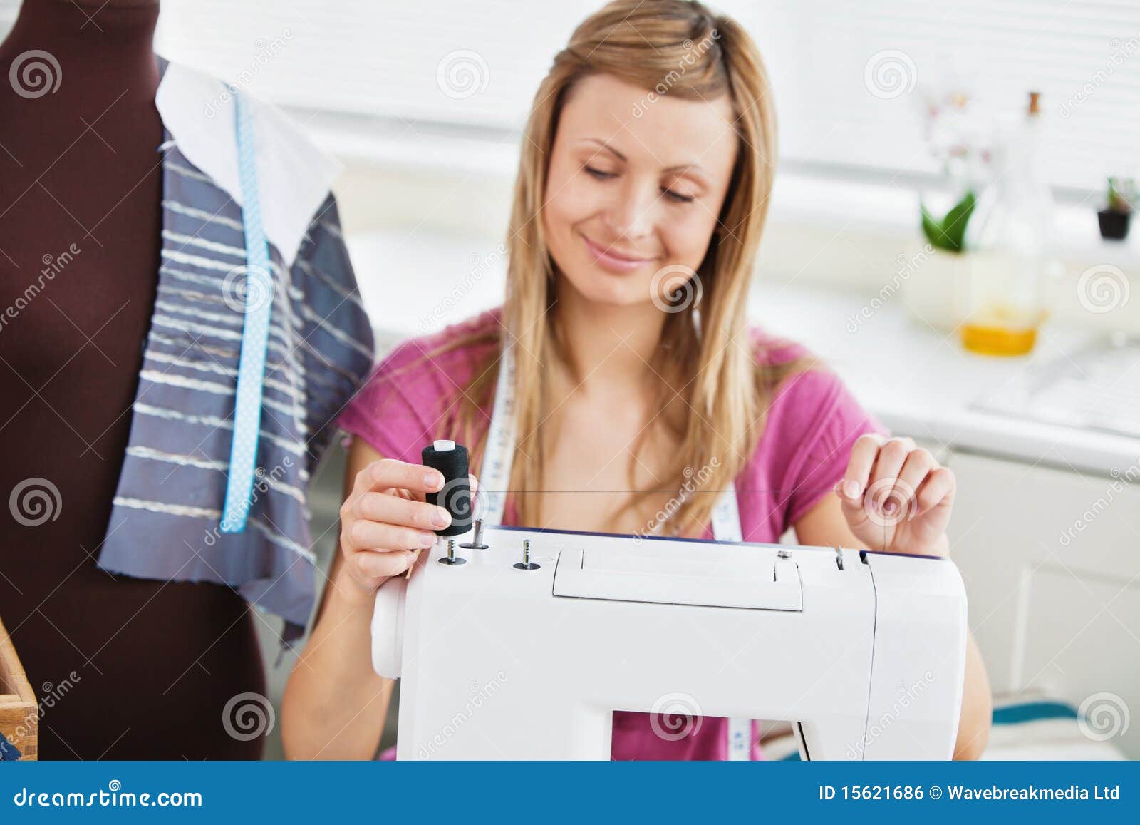 Bright Young Woman Using Her Sewing Machine Stock Photo - Image of ...
