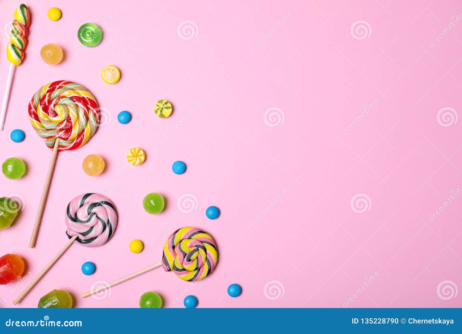 Bright Yummy Candies and Space for Text on Color Background Stock Photo ...