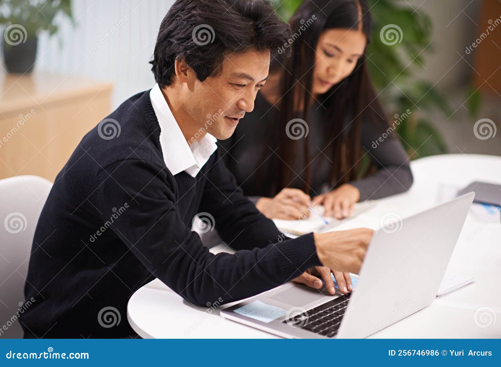 The Brightest Minds of the Business. Two Business Professionals Working ...