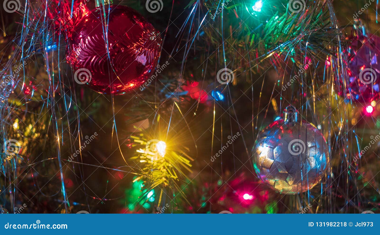 Brightly Colored, Cheery Christmas Tree Ornaments Hung Up with Lights ...