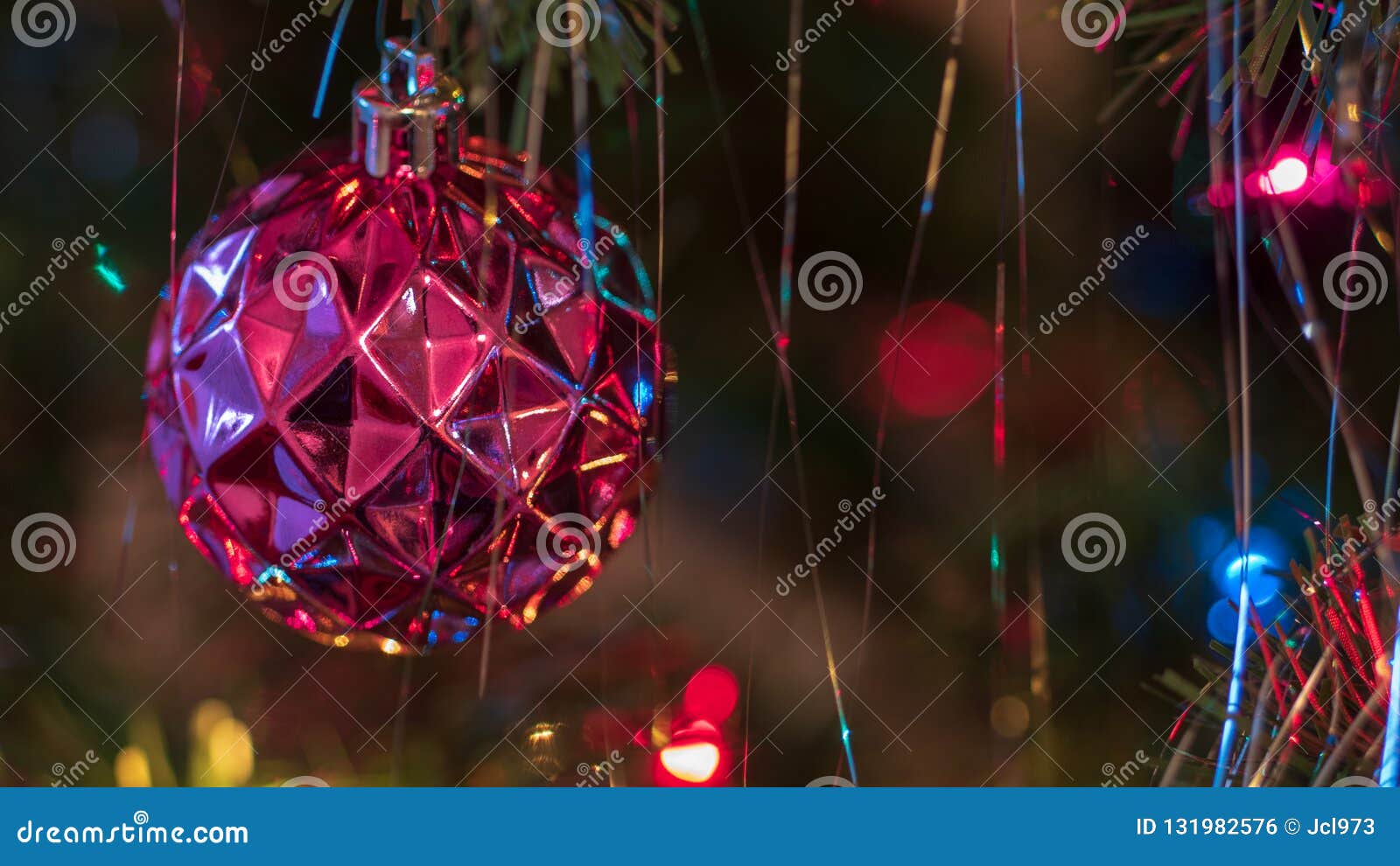 Brightly Colored, Cheery Christmas Tree Ornaments Hung Up with Lights ...