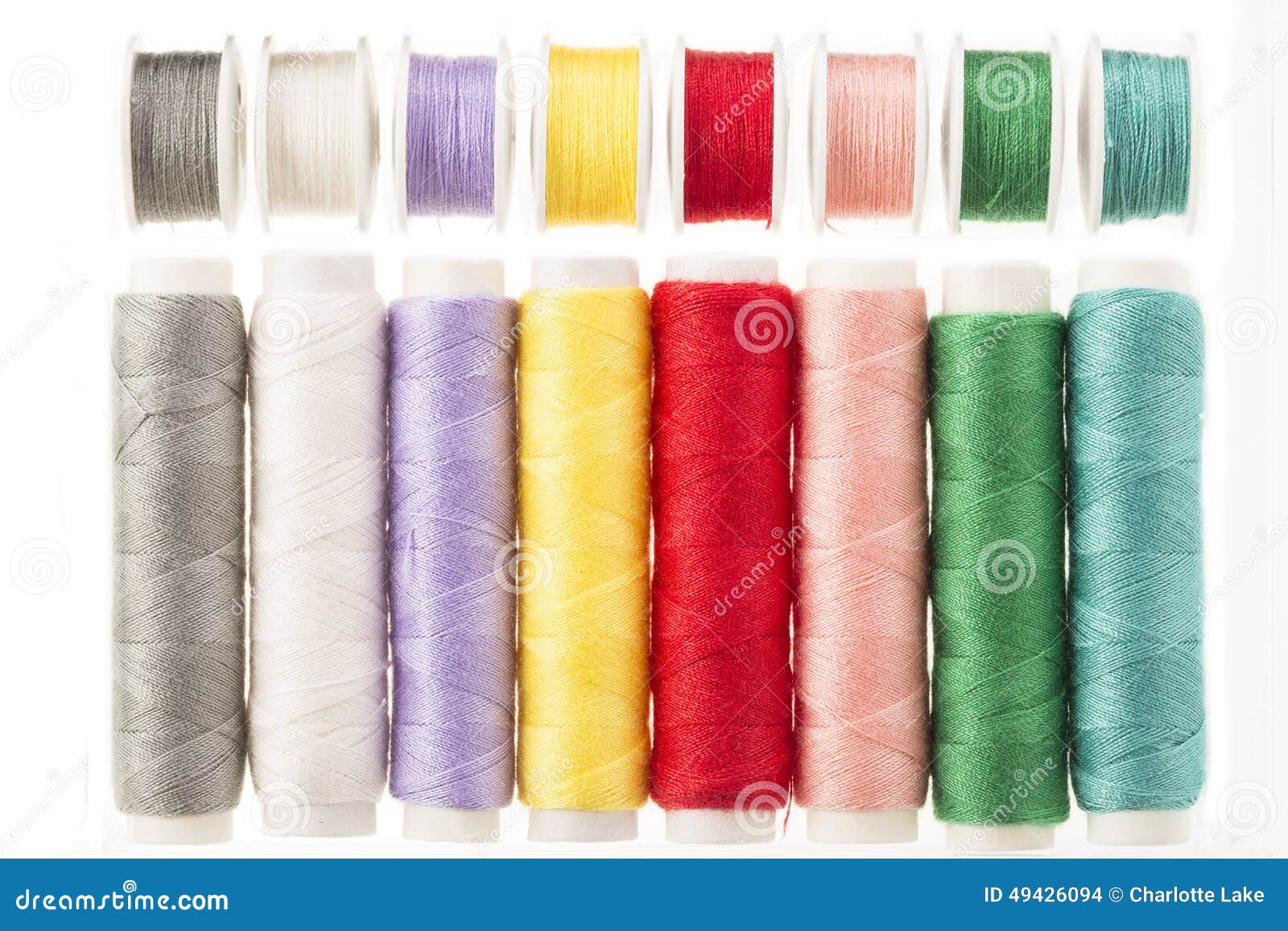 Brightly Colored Spools of Thread Stock Photo - Image of group ...