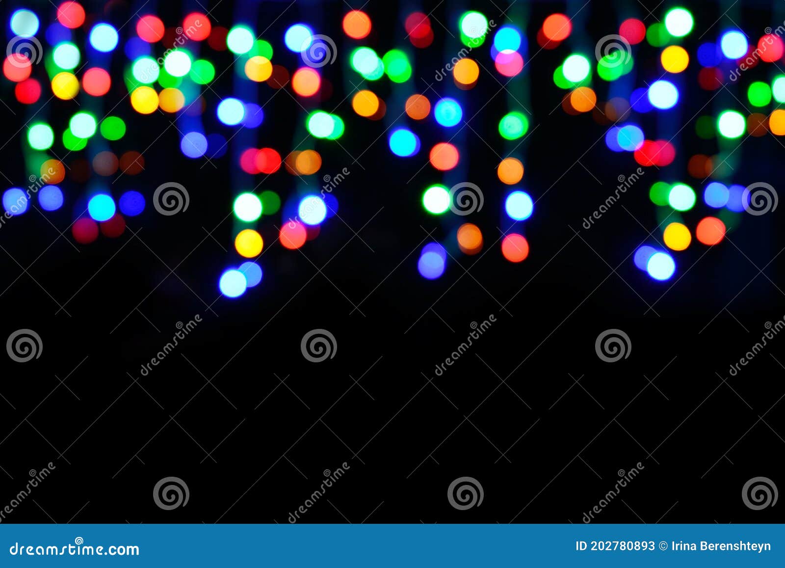 Brightly Coloured Coloured De-focused Lights Against Black Background ...
