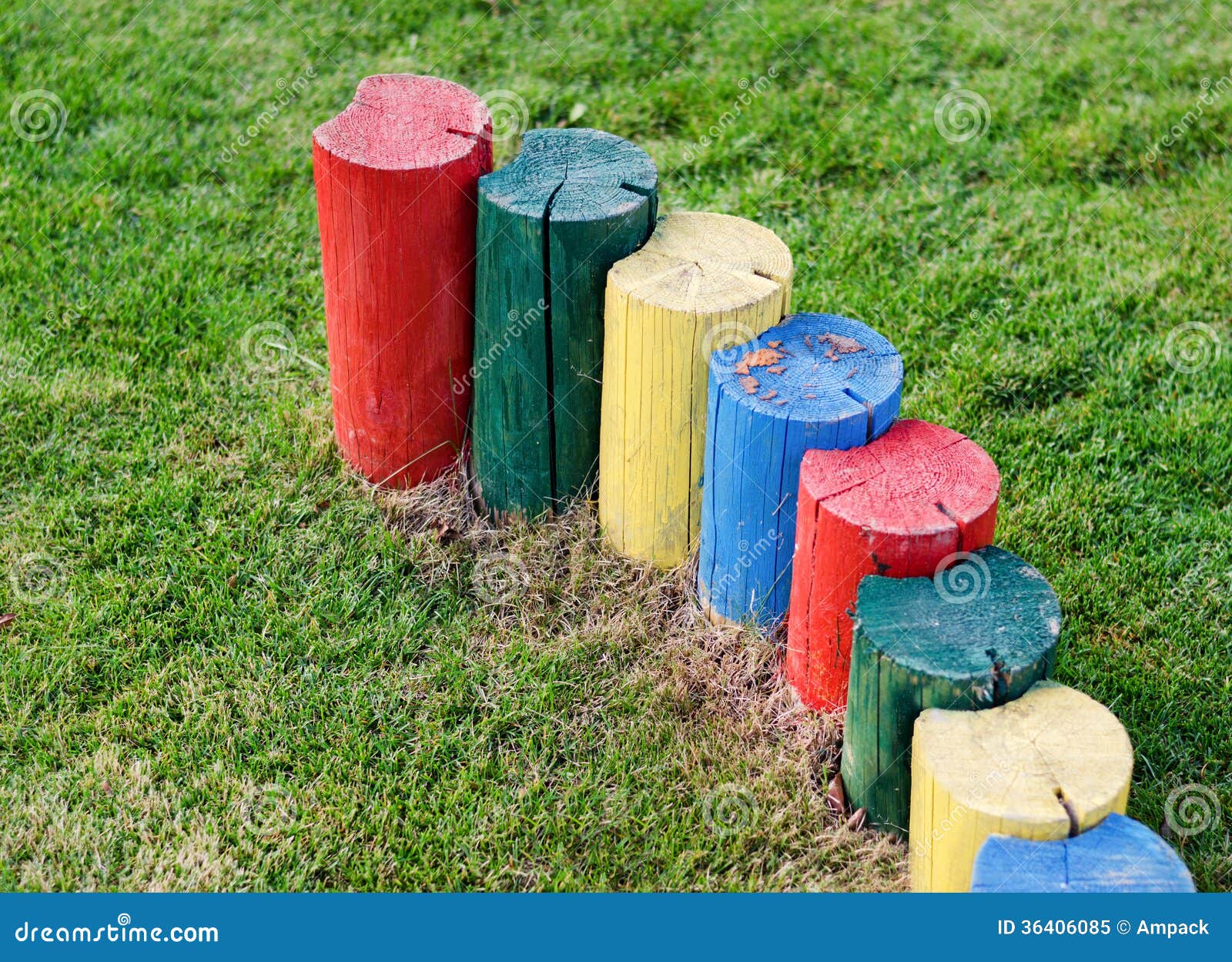 Brightly Coloured Tree Stumps Forming a Barrier Stock Image - Image of ...