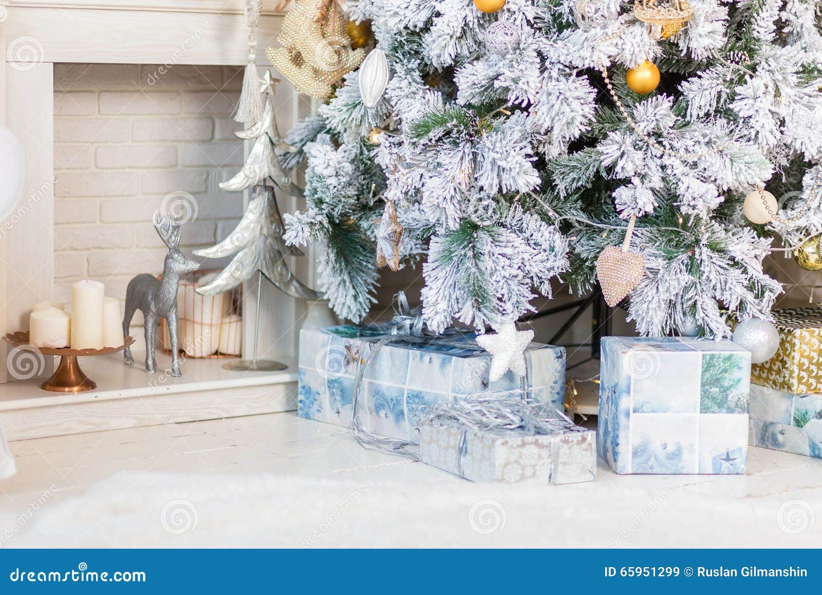 Brightly Lit Christmas Tree with Lots of Gifts Stock Image - Image of ...