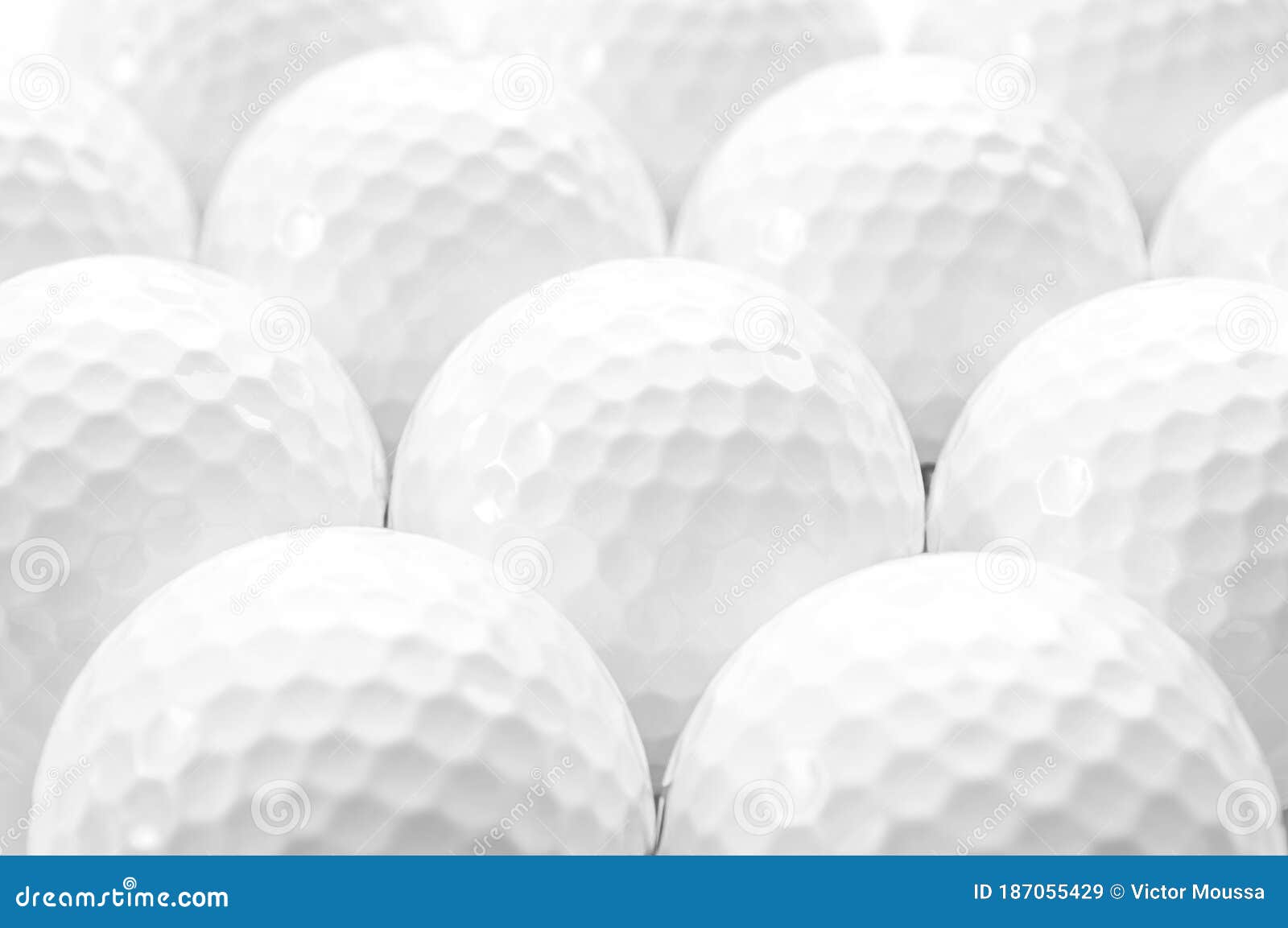 Brightly Lit Image of Several Golf Balls Creating a Full Frame Pattern ...
