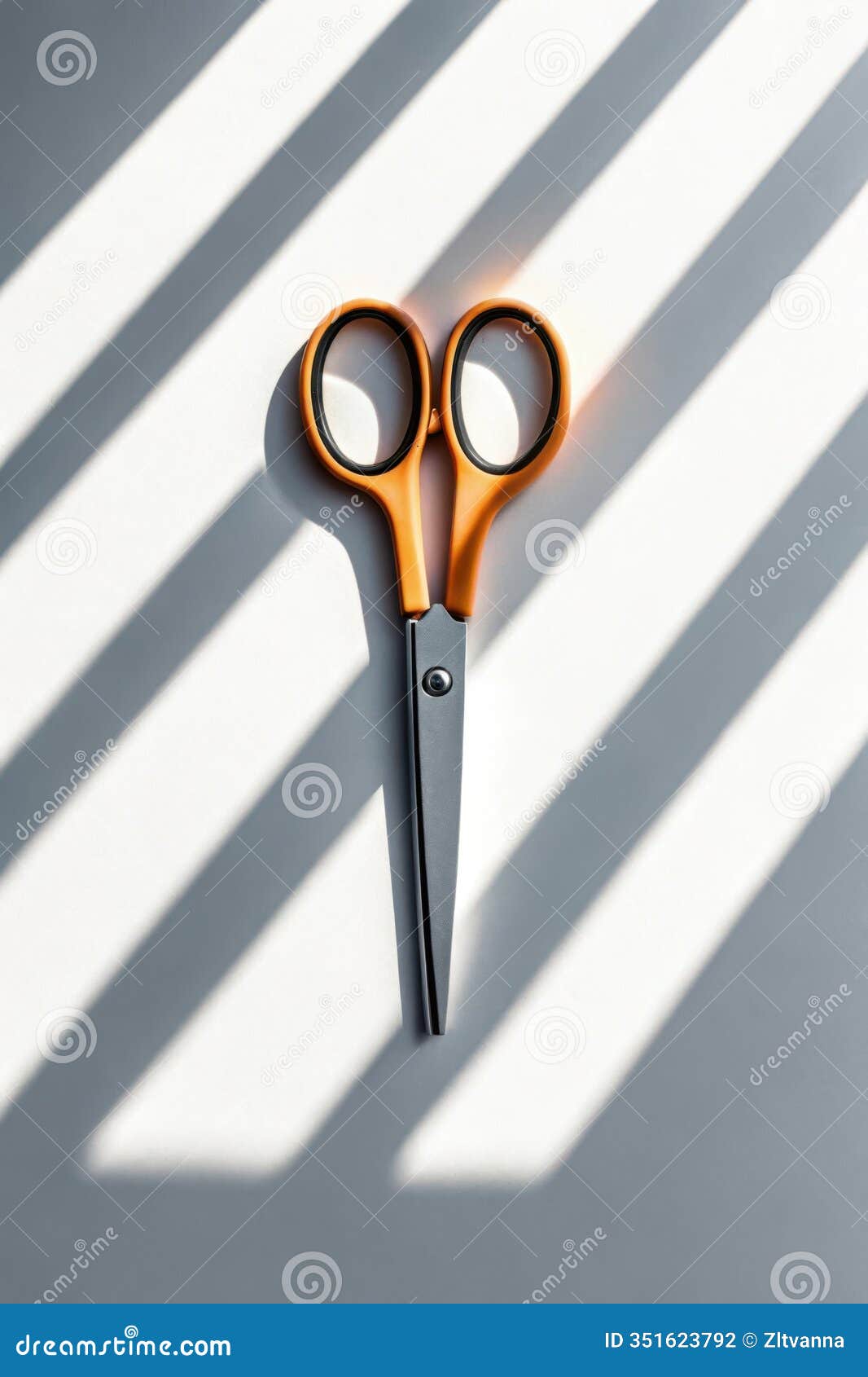 Brightly Lit Scissors Placed on a Surface with Shadows Creating a ...