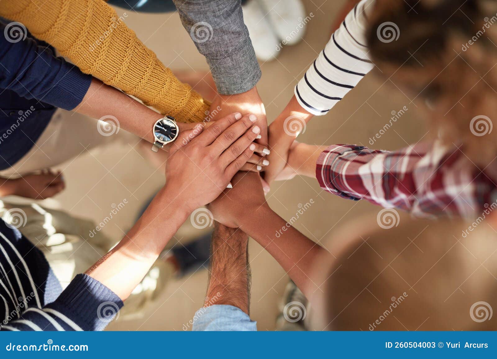 Bring it in. High Angle Shot of a Group of People Joining Their Hands ...
