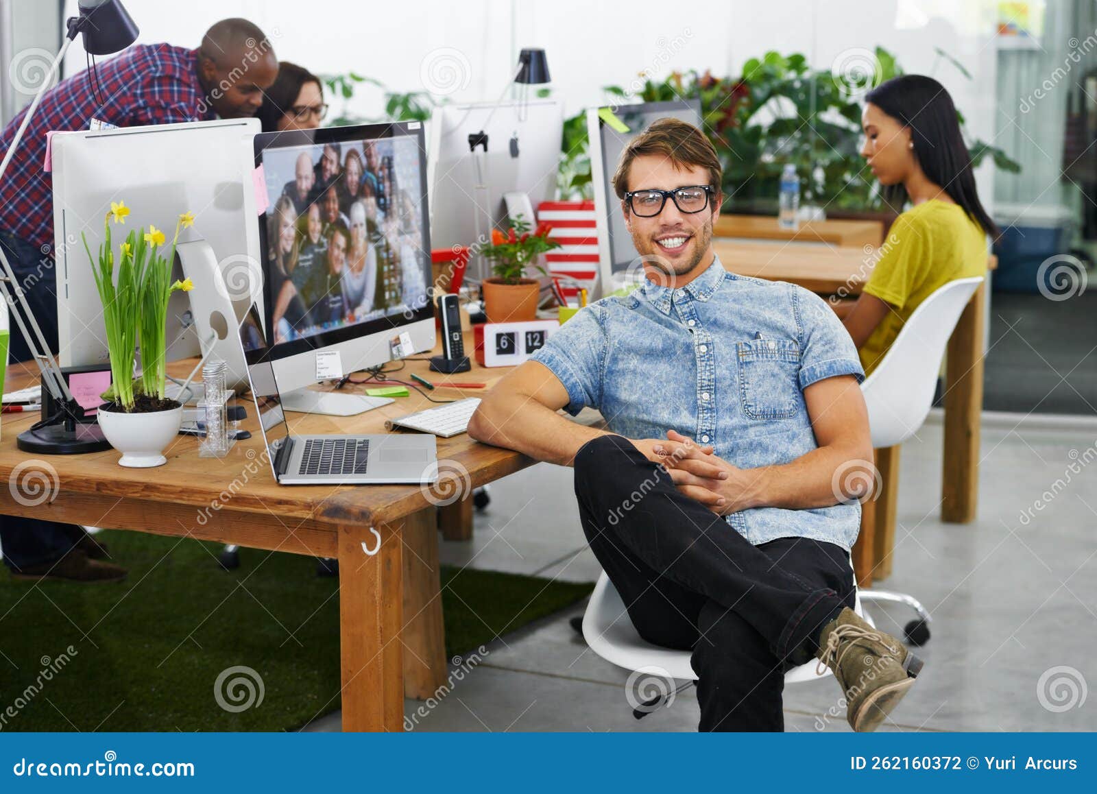 Bringing Ideas into Focus. a Young Designers at Work in an Office ...