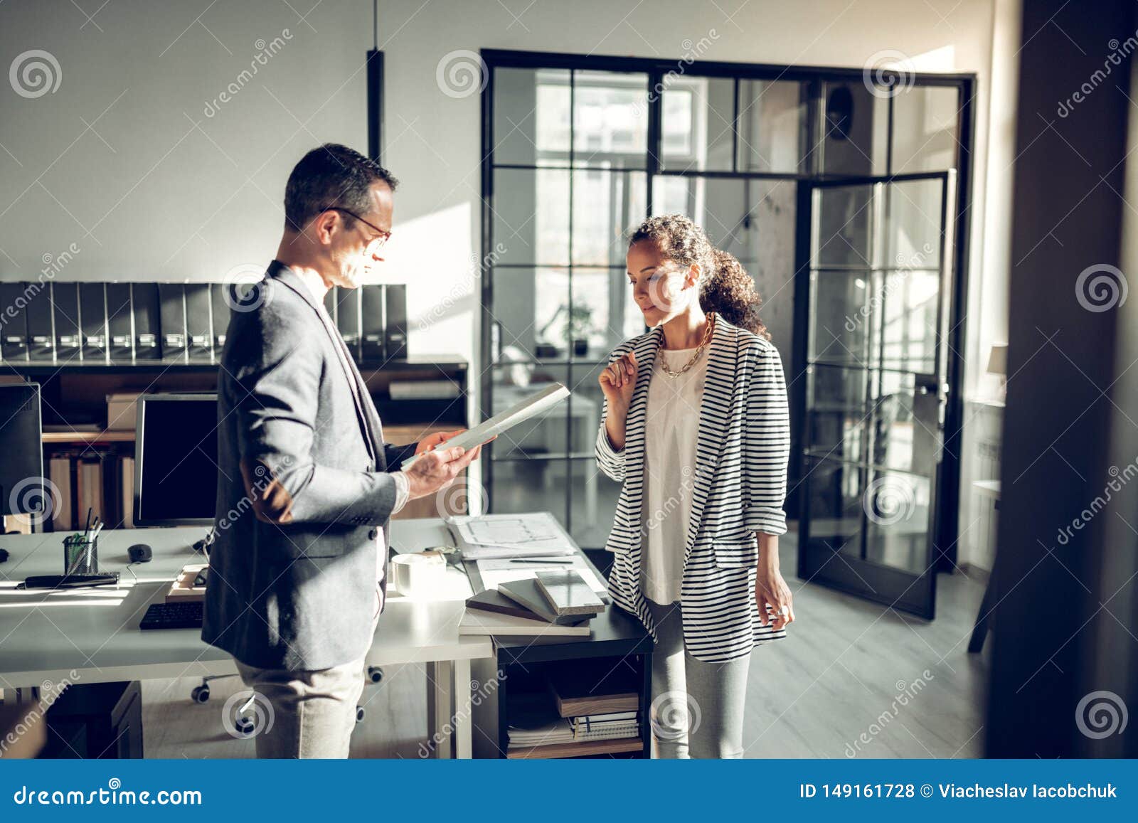 Helpful Secretary Bringing Some Documents for Her Busy Boss Stock Photo ...