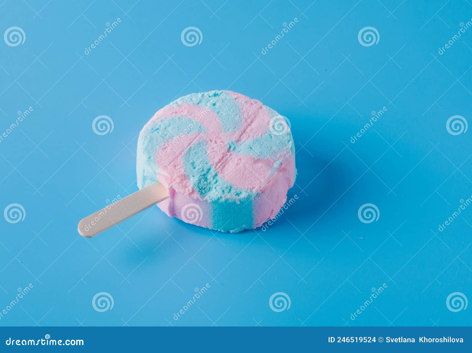 Briquette of Round Popsicles on a Stick on a Blue Background Stock ...