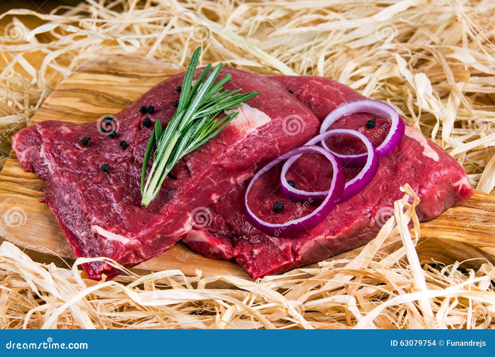 British Beef Flat Iron Steak on Cutting Board and Straw, Rosemary and ...
