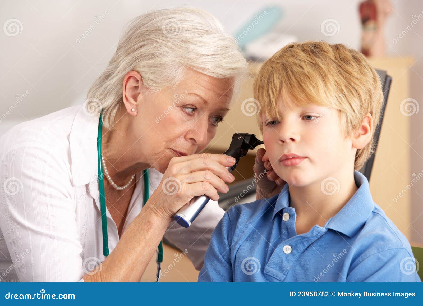 British GP Examining Young Boy S Ear Stock Photo - Image of medical ...