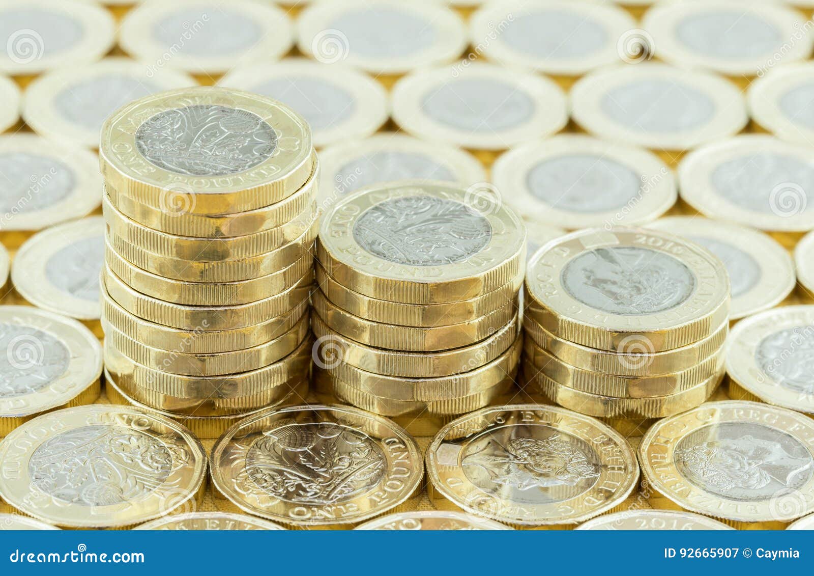 British Money, New Pound Coins in Three Stacks. Stock Image - Image of ...