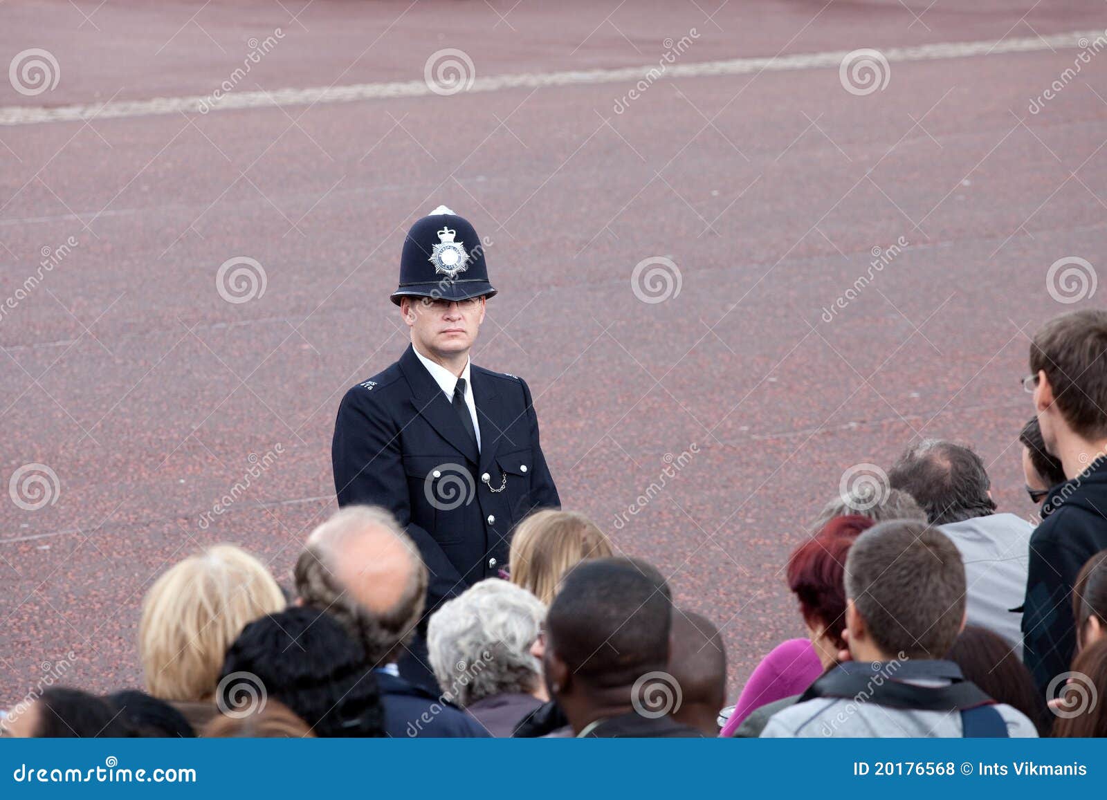 British Policeman Walking Past A Royal Guard At The Entrance To His ...