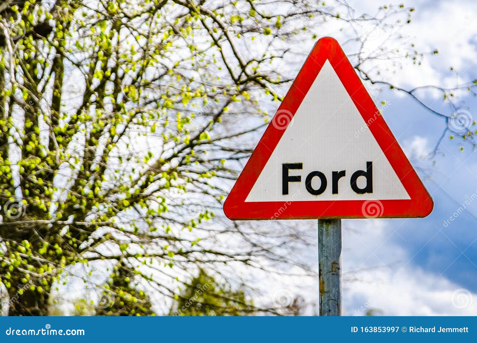 British Triangular Street Sign Showing the Word Ford Against Spring ...
