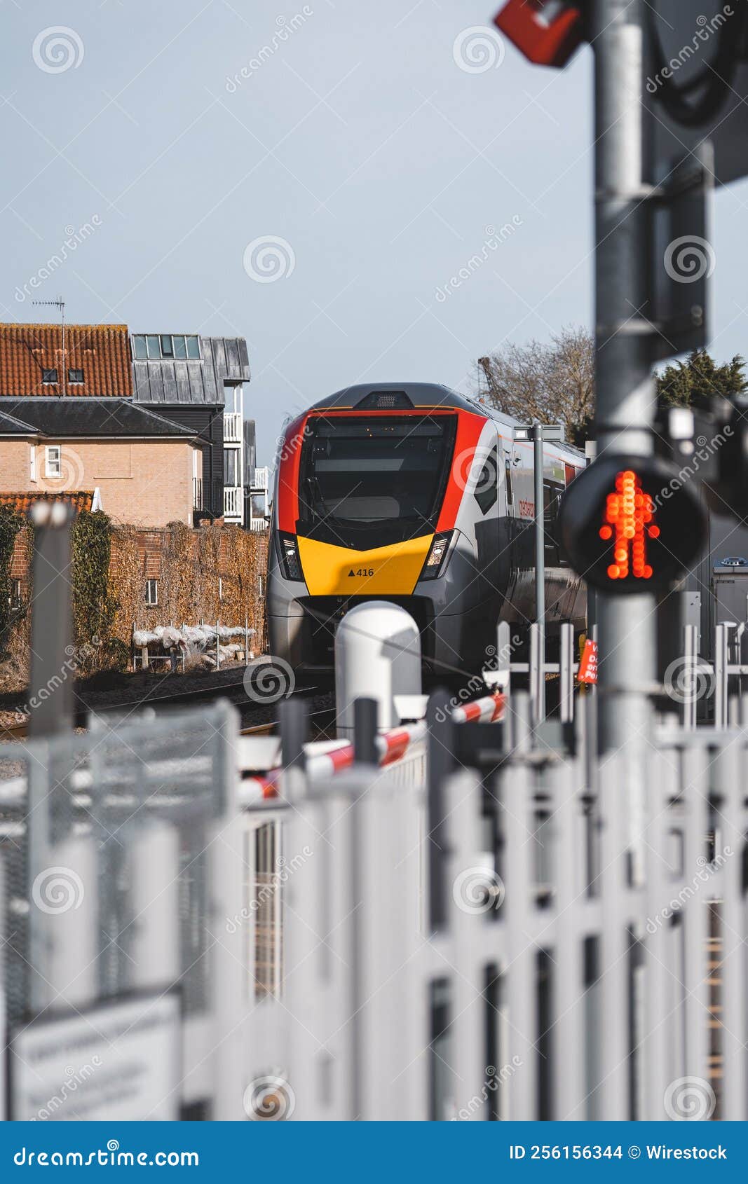 British Train Pulling Up at a Level Crossing Editorial Stock Image ...
