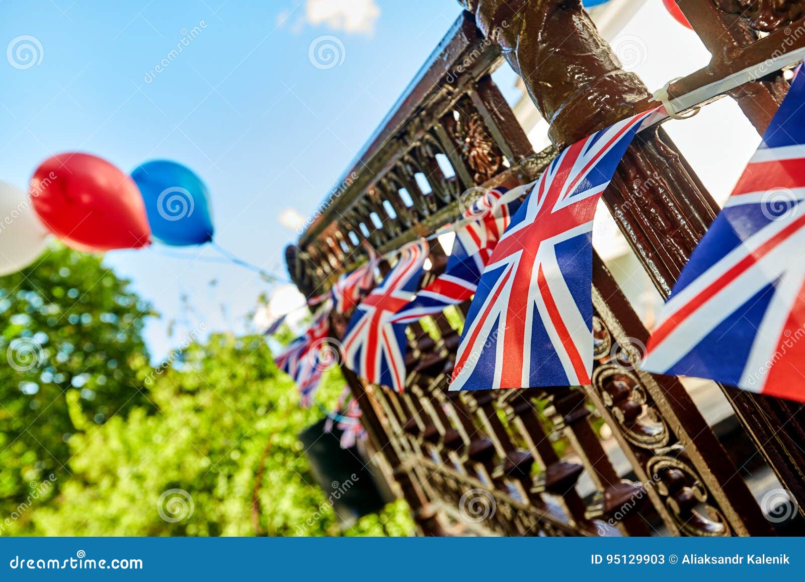 British Union Jack Bunting Flags Against Blue Sky Stock Image - Image ...