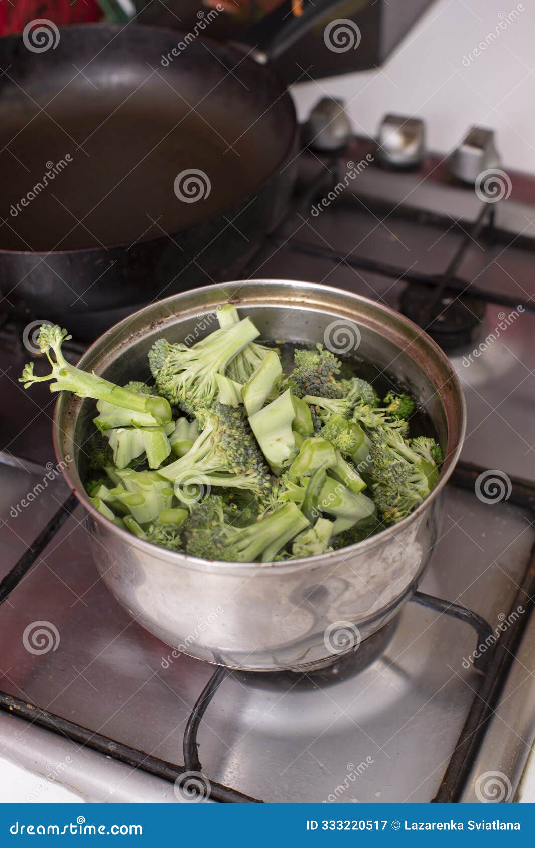 Broccoli is Cooked on the Stove in a Pan Stock Image - Image of kitchen ...