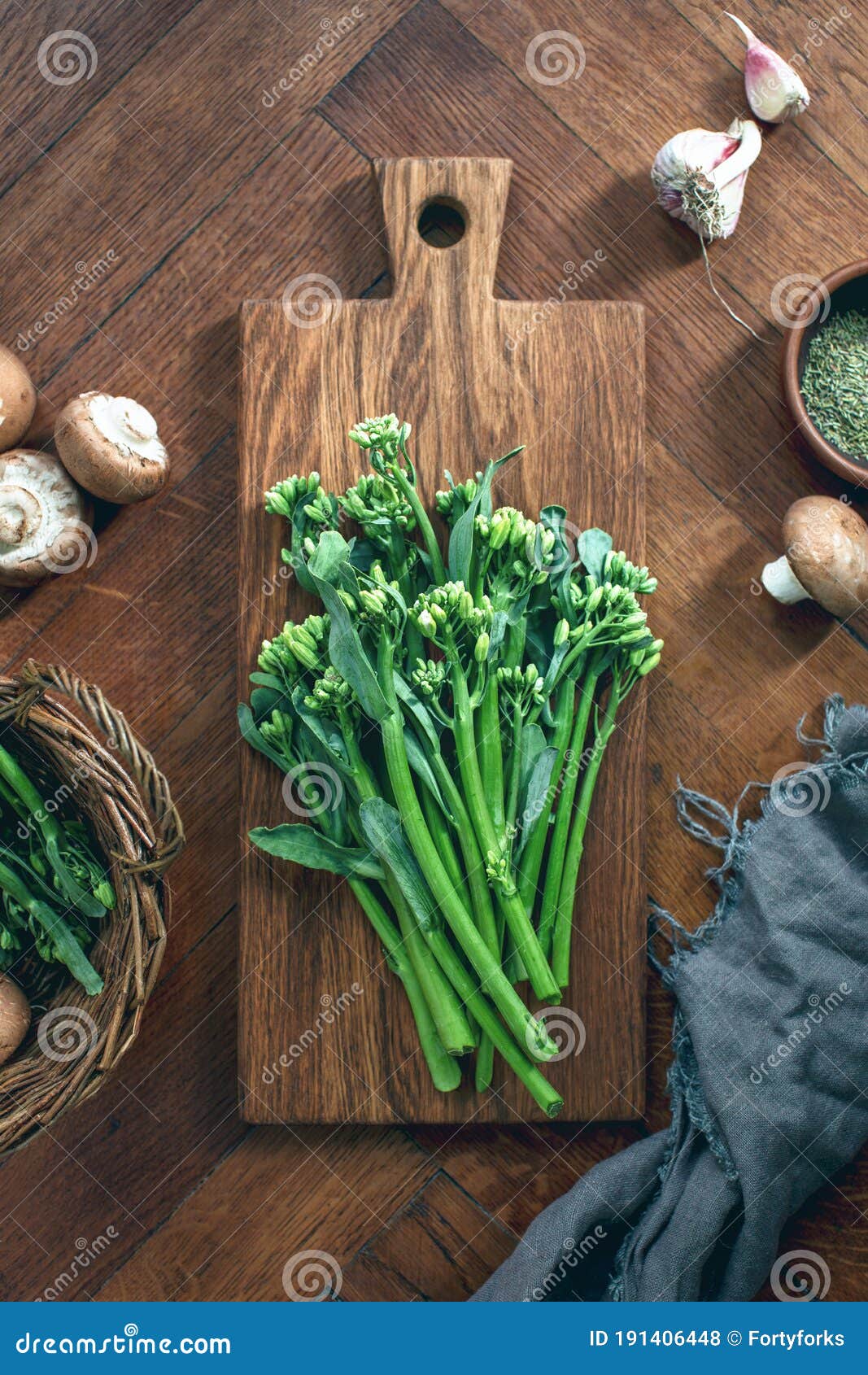 Broccolini Fresh Bunch on a Rustic Cutting Board Ready for Cooking ...