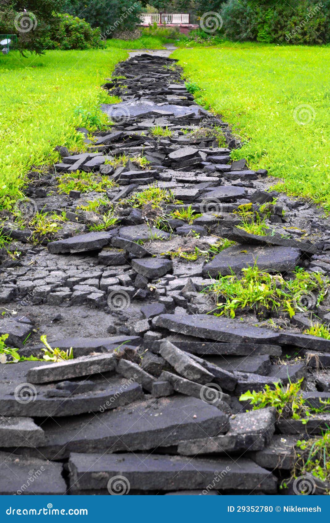 The Broken Asphalt in the Green Grass Stock Photo - Image of closeup ...