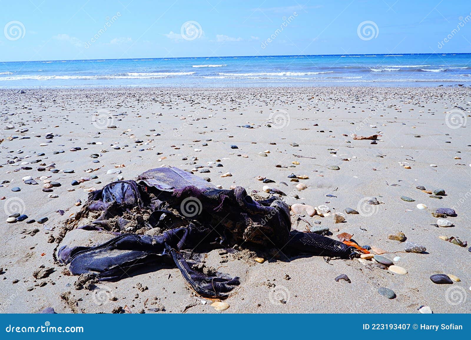 Broken bag on the beach stock image. Image of metal - 223193407