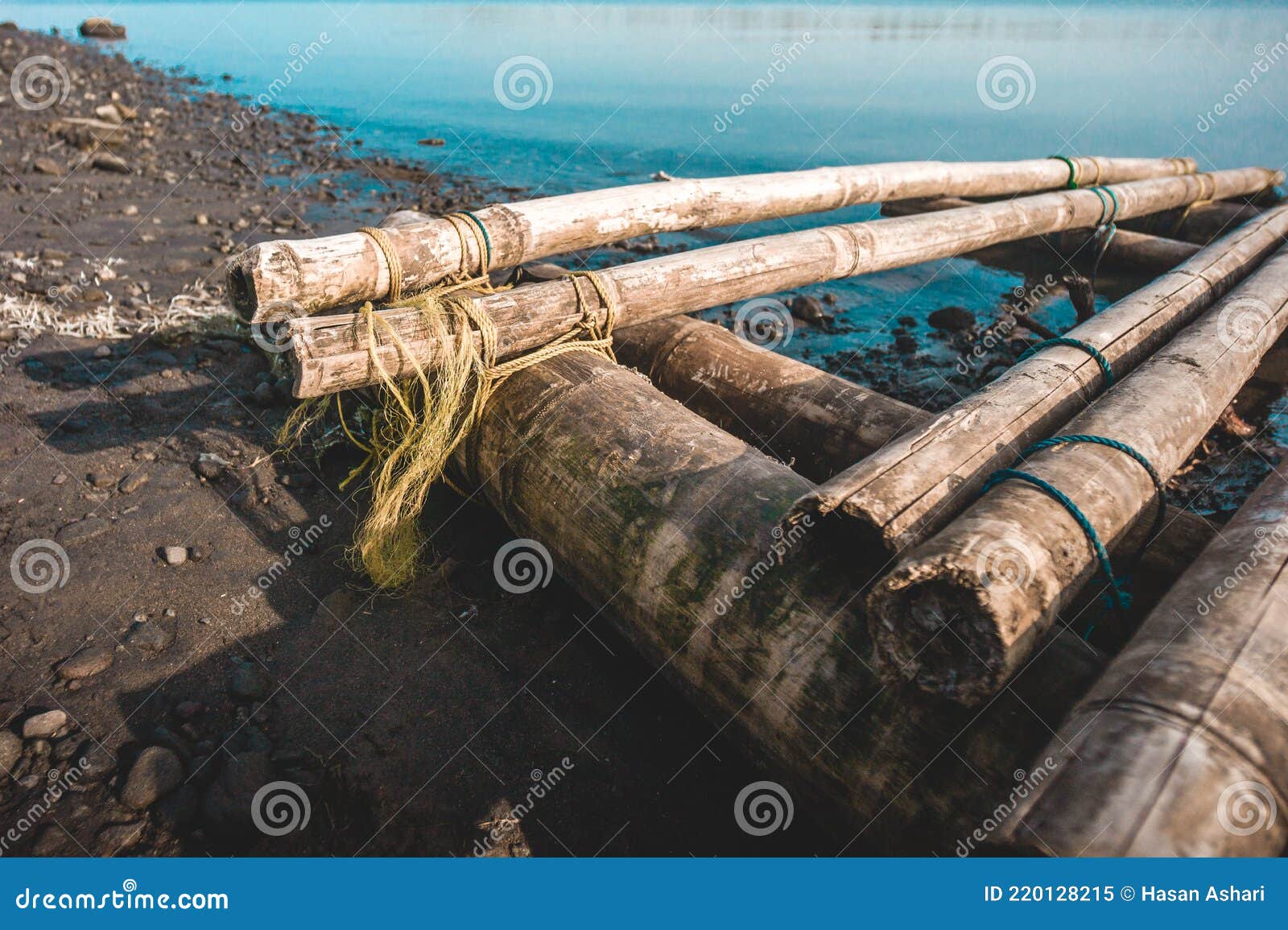 A Broken Bamboo Canoe Stranded on the Edge of the Lake Stock Image ...