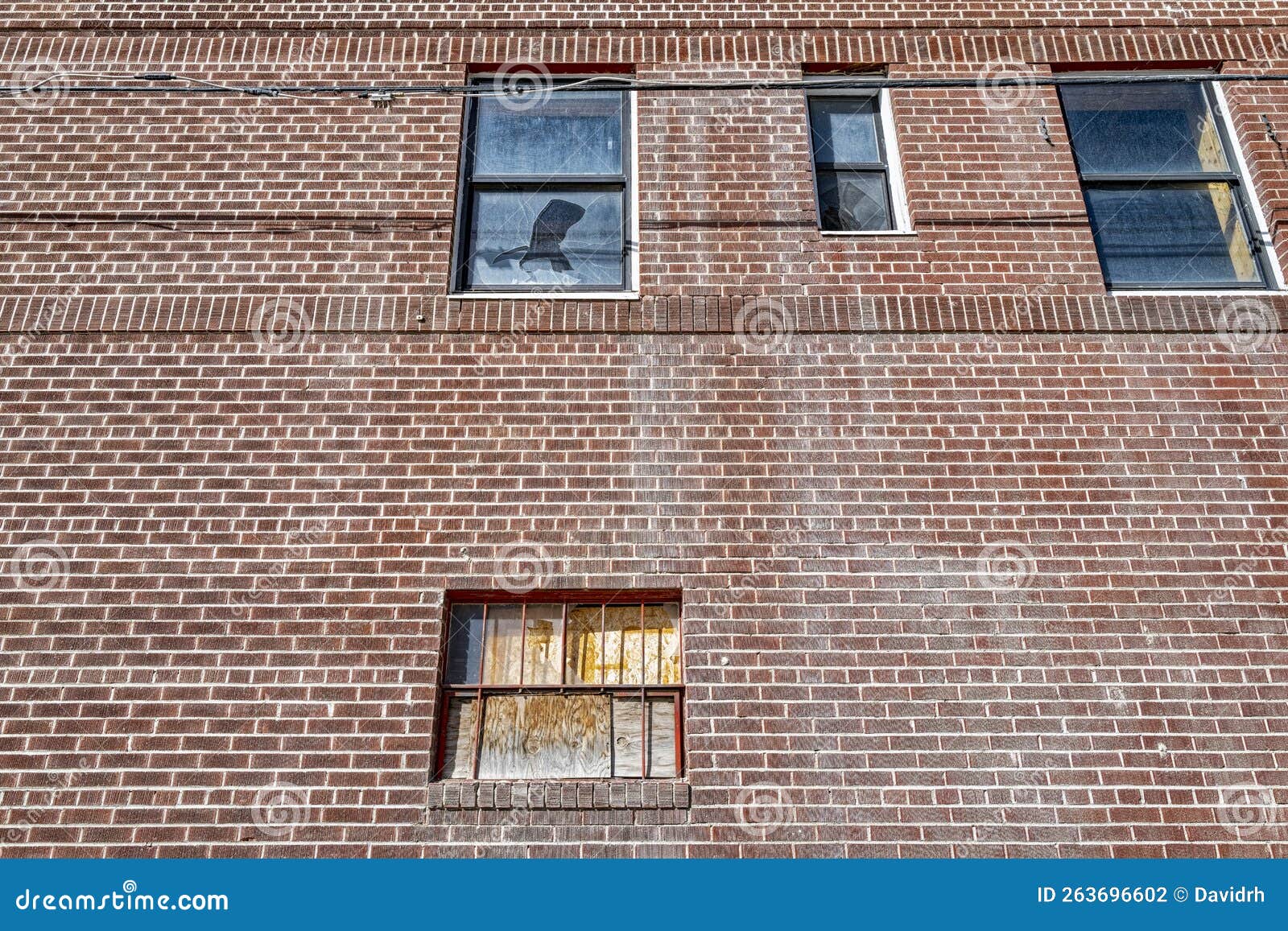 Boarded Windows In Old Brick Wall Covered With Red Flaking Plaster ...