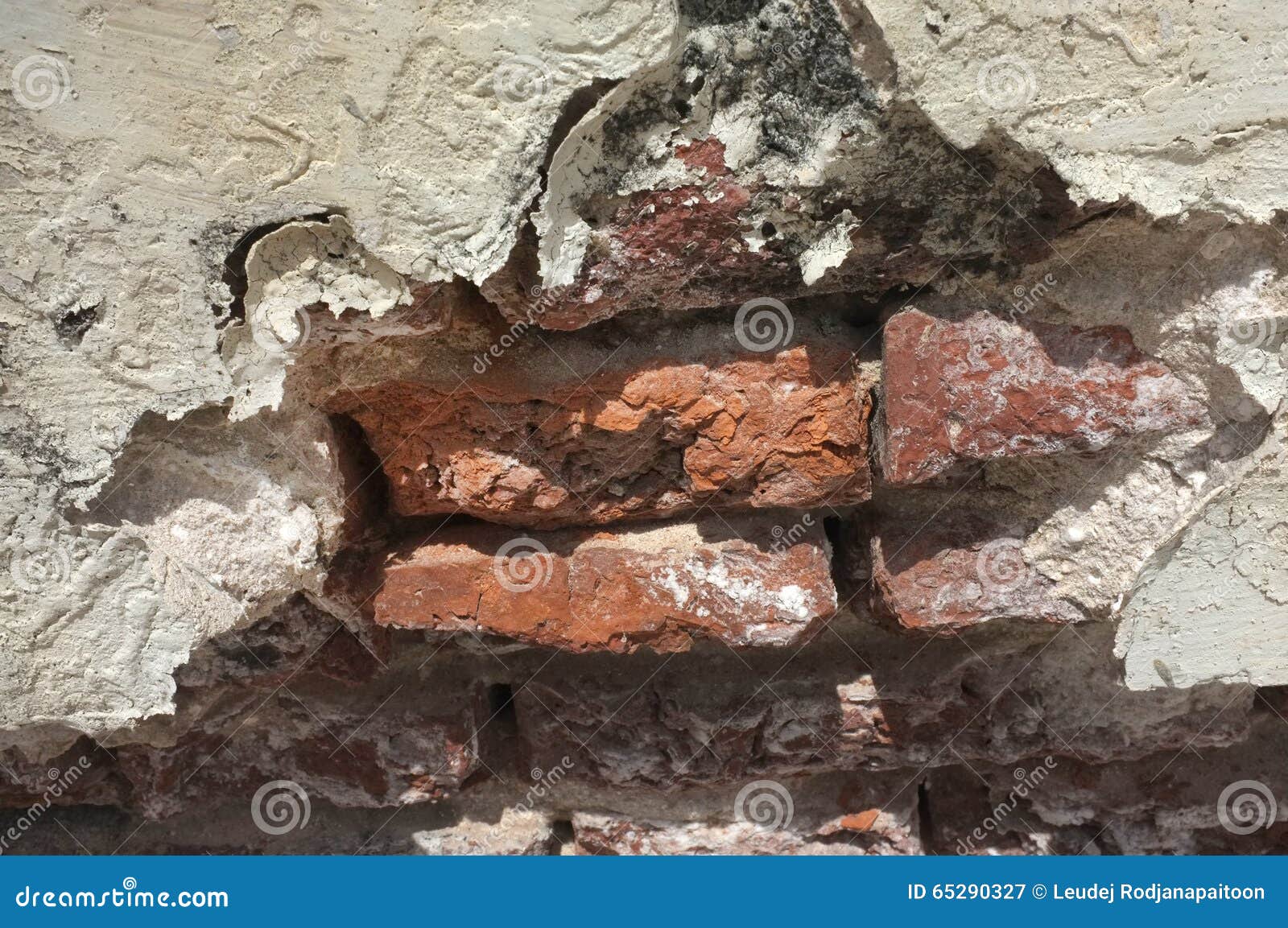 Broken brick in white wall stock image. Image of exterior - 65290327