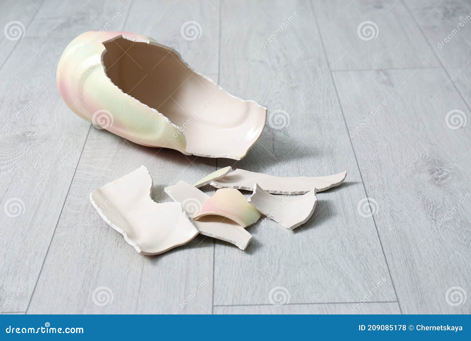 Broken Bright Ceramic Vase on Wooden Floor Stock Photo - Image of ...