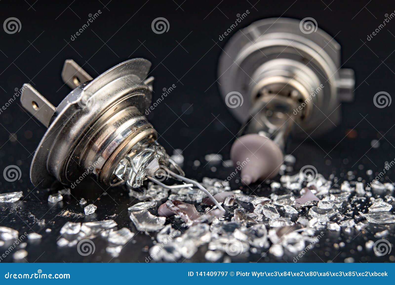 Broken Bulb for the Car Headlight. Spilled Glass and Broken Filament on ...