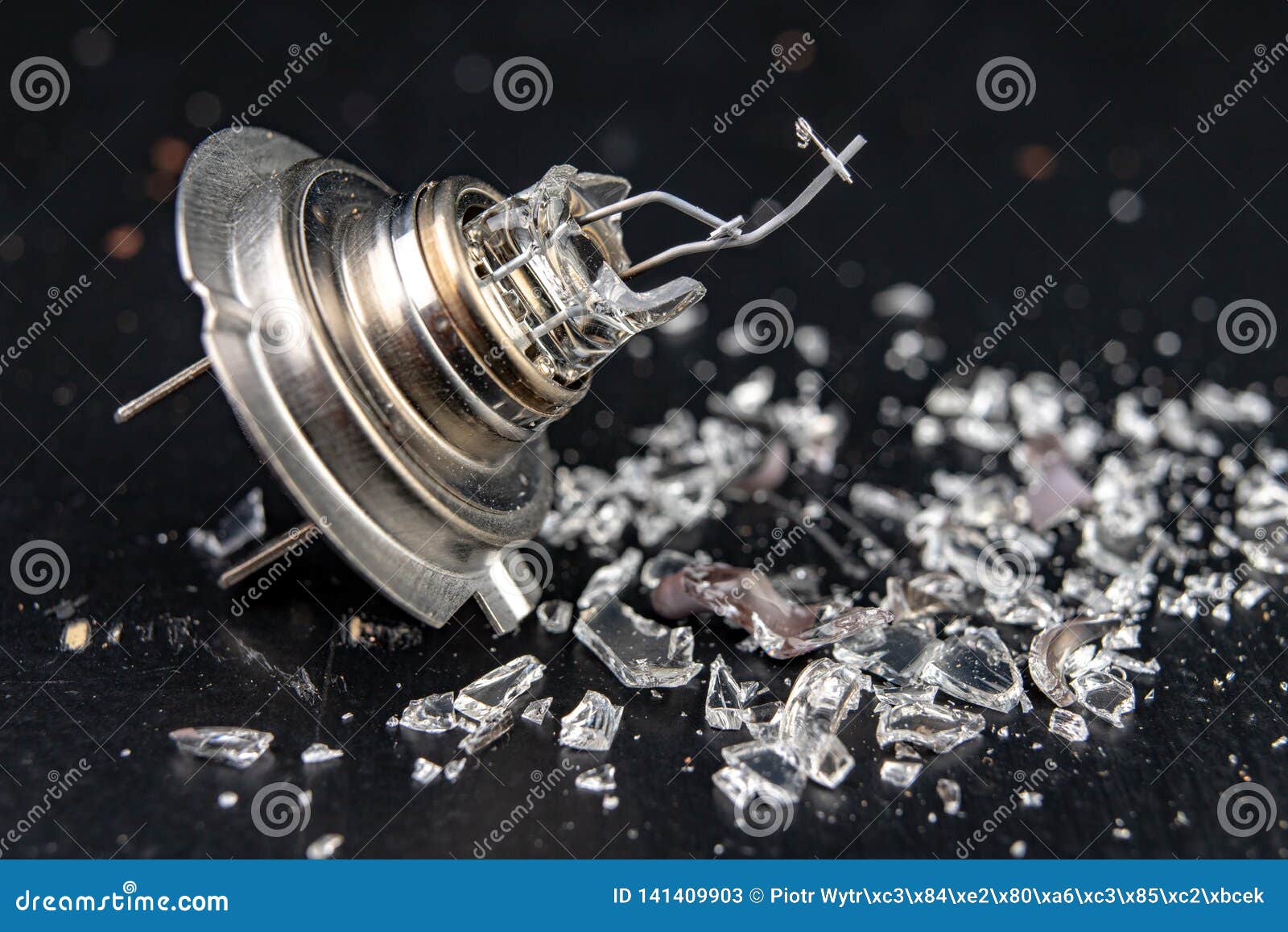 Broken Bulb for the Car Headlight. Spilled Glass and Broken Filament on ...