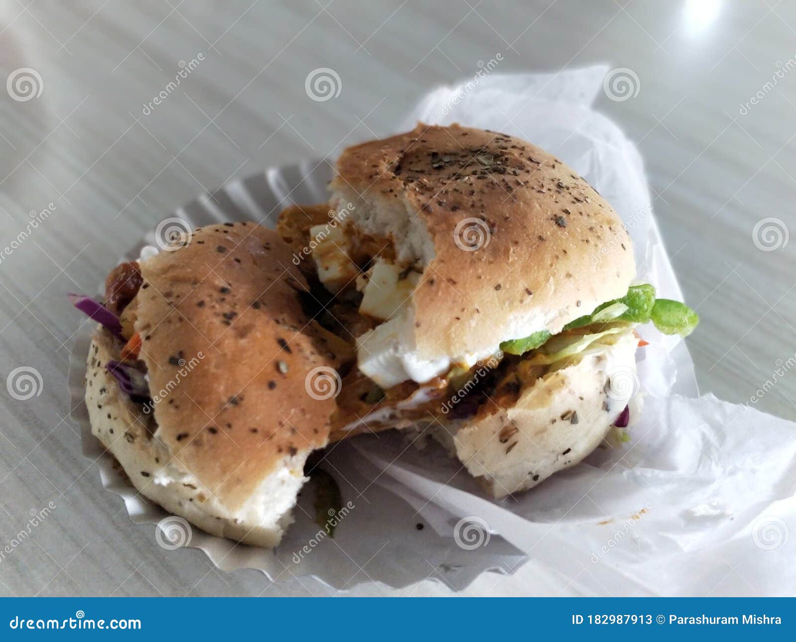Broken Burger with Tissue on Table Stock Image - Image of broken ...