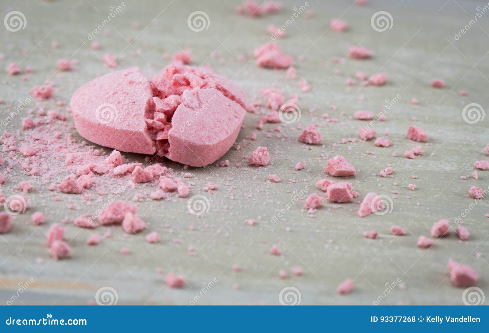 Broken Candy Heart with Crushed Candy Bits Strewn Around Stock Photo ...