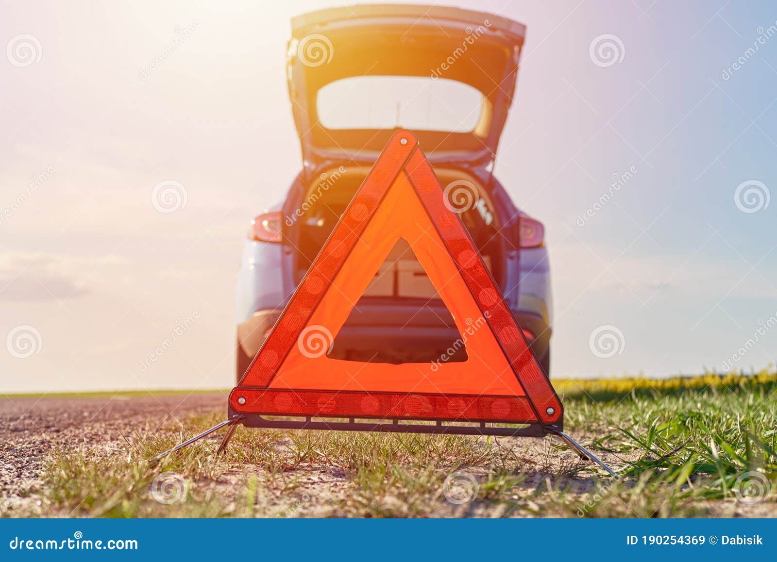 Broken Car on the Road and Emergency Stop Sign. Trouble with a Car ...