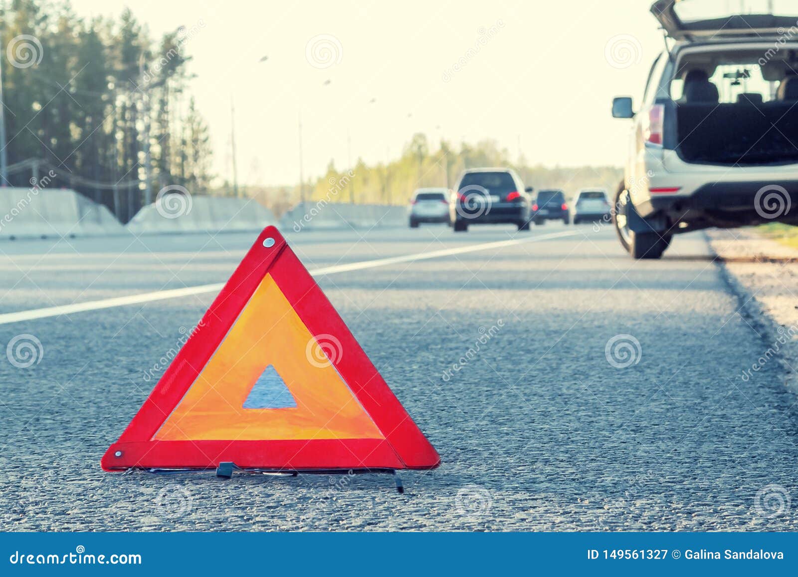 Broken Car on the Side of the Highway and an Emergency Stop Sign Stock ...