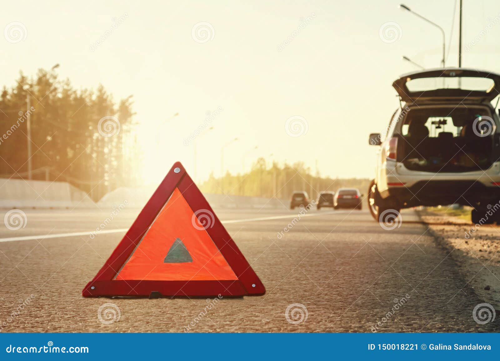 Broken Car on the Side of the Highway and an Emergency Stop Sign Stock ...