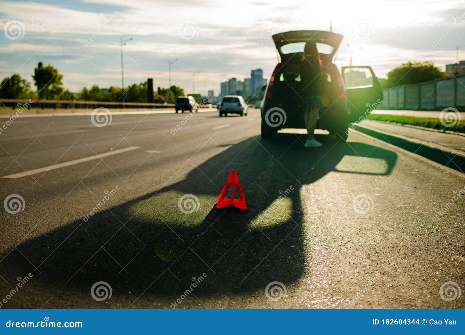 Broken Car on the Side of the Highway and an Emergency Stop Sign Stock ...
