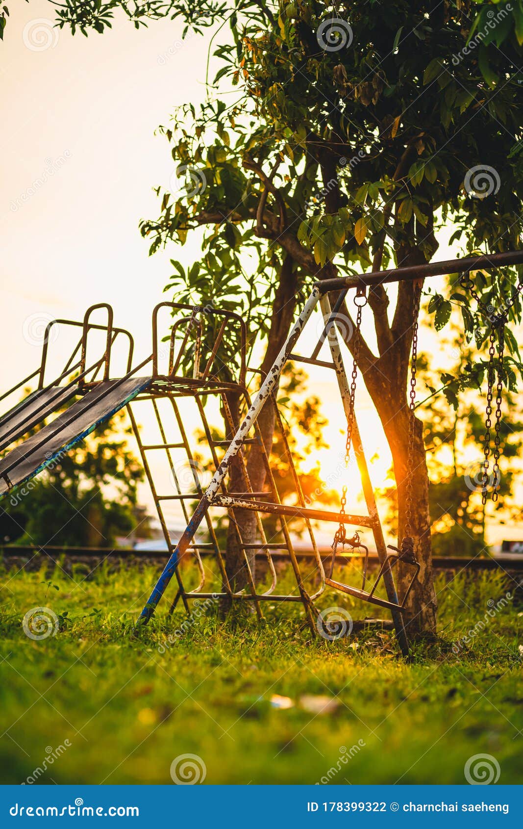 Broken Chain Swing in Playground and Light of Sunset Stock Photo ...